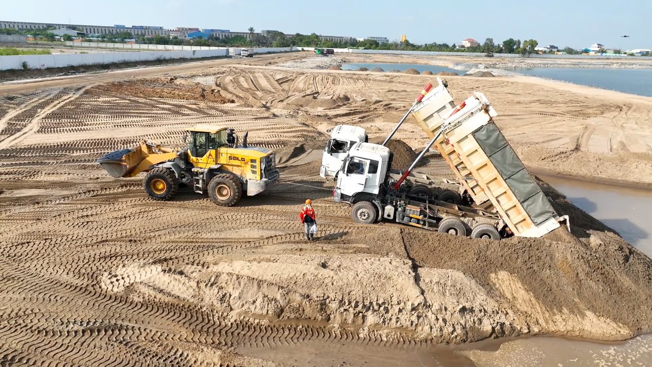 Wheel Loader Push Sand Into Water With DumpTrck SHACMAN Transporting ...