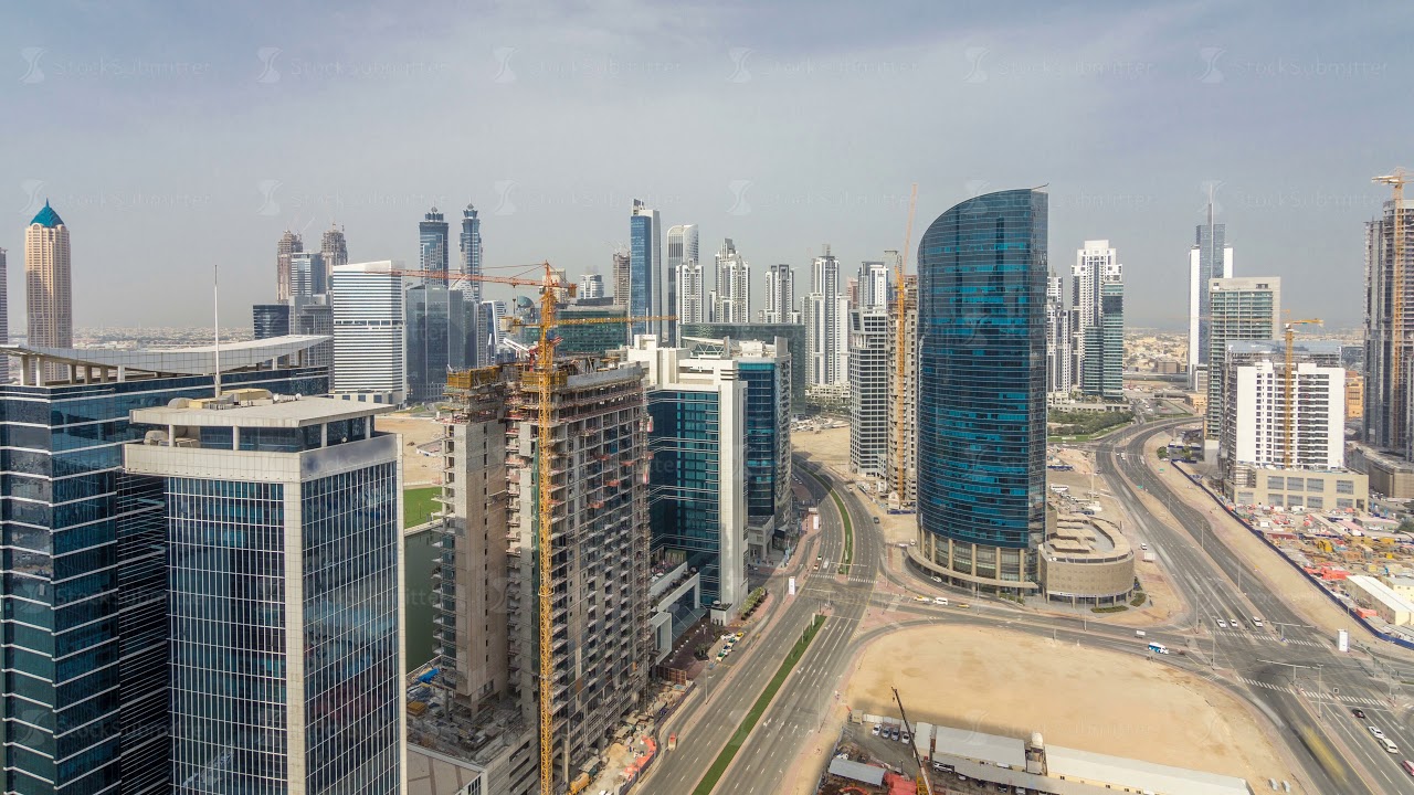 Dubai business bay towers at day time aerial timelapse. - YouTube