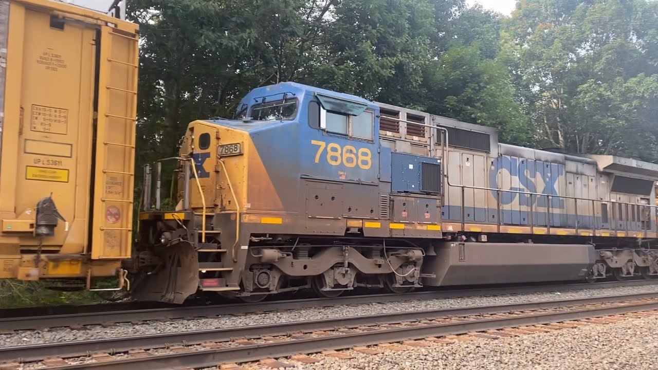 CSX M264 huge train with 7868 and 3 engines thru a hazy day - YouTube