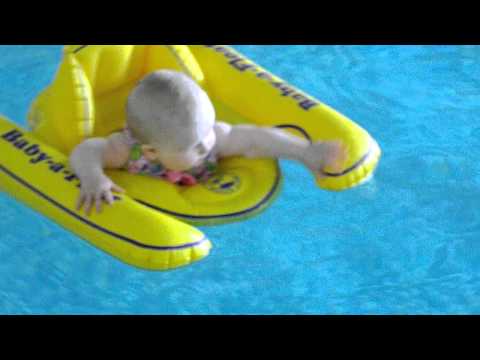Cute baby girl goes swimming!