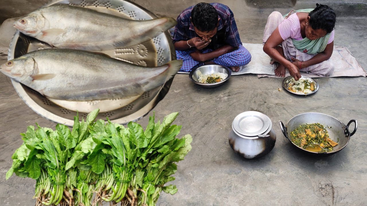 Santali tribe couple cooking & eating River big foli fish with mulo ...