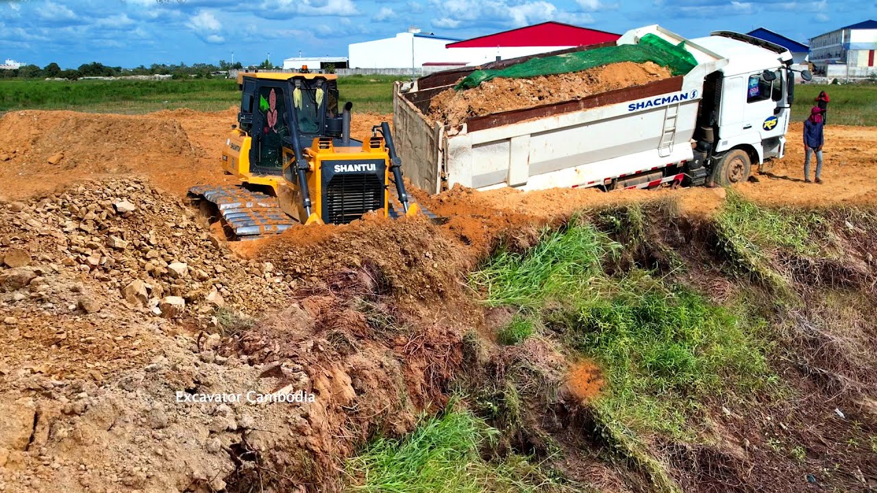 A dump truck stuck in deep mud is rescued by skills operator heavy ...