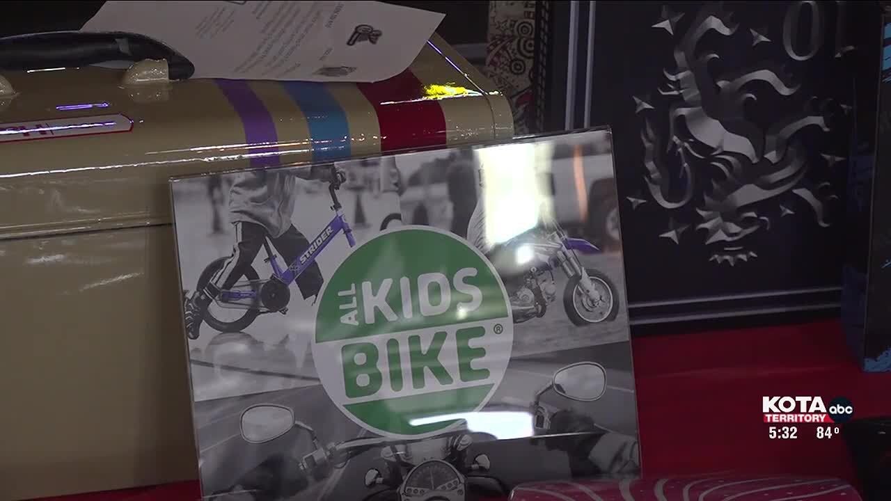 Benefit breakfast at Sturgis rally helps kids learn to ride bikes - YouTube