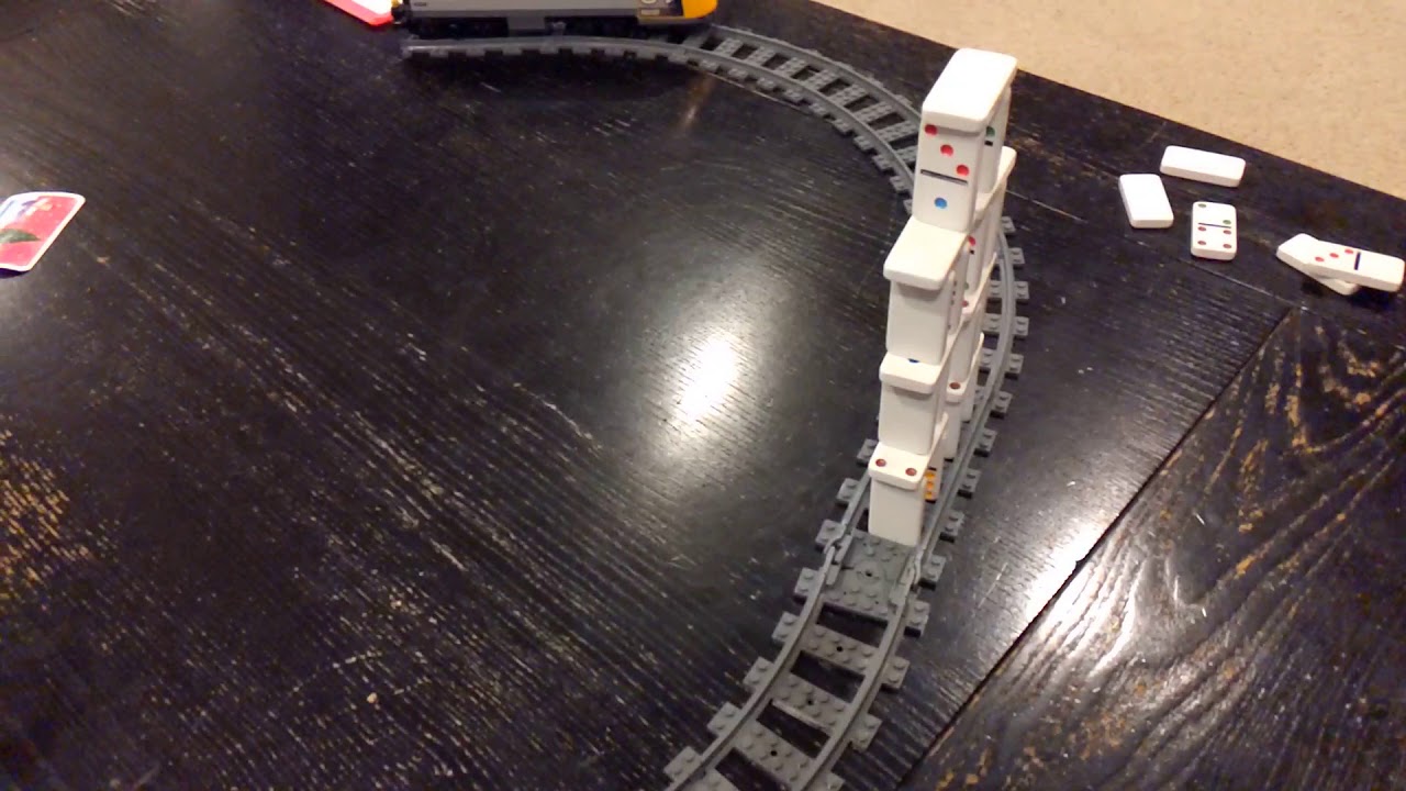 Lego Train Crashes into small Domino tower - YouTube