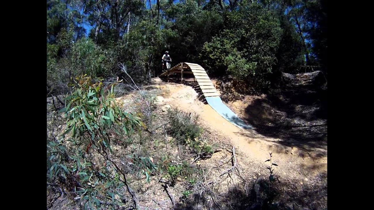 Penguin mountain bike park wooden drop off - YouTube