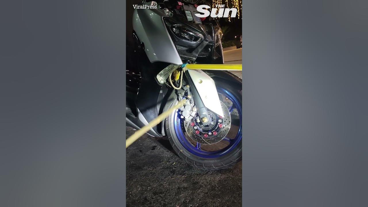 Moment enormous wild python caught hiding inside motorcycle #shorts 🐍 ...