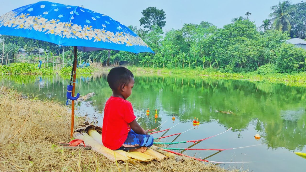 unique fishing video - little boy catching big fish by hook in ...
