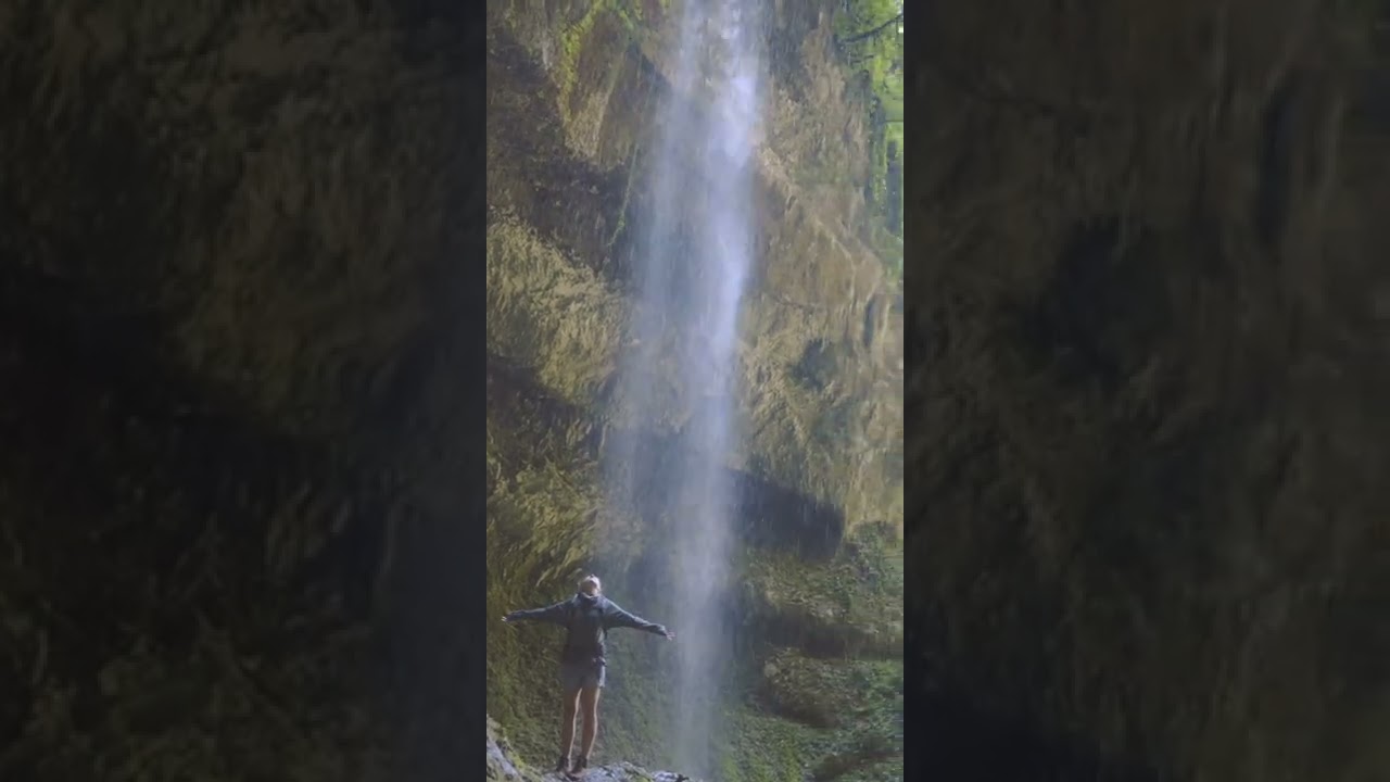 Woman walking under the waterfalls - YouTube
