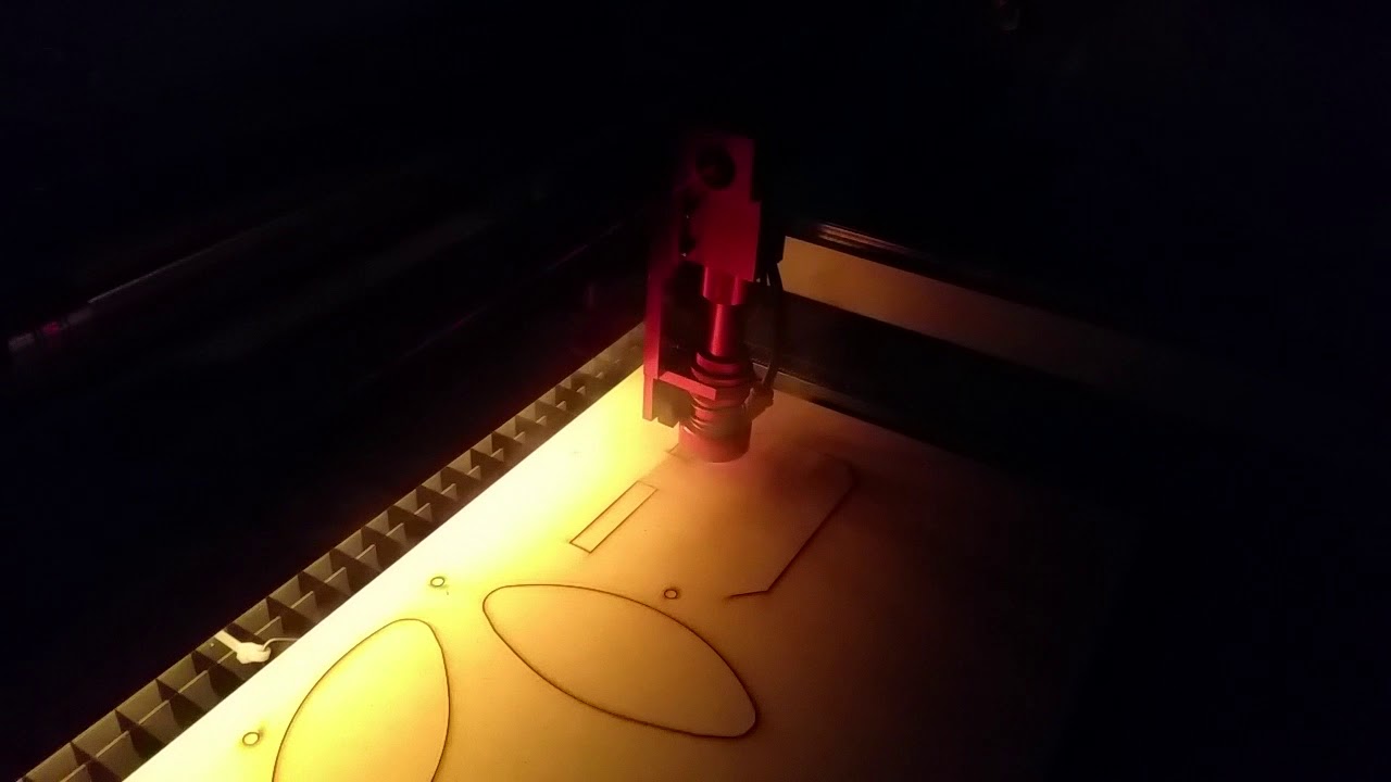 Cool laser beam of laser cutter through smoke - YouTube