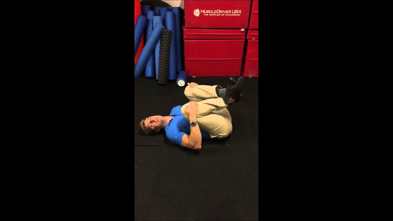 Knees rocking for lumbar spine mobilisation - YouTube