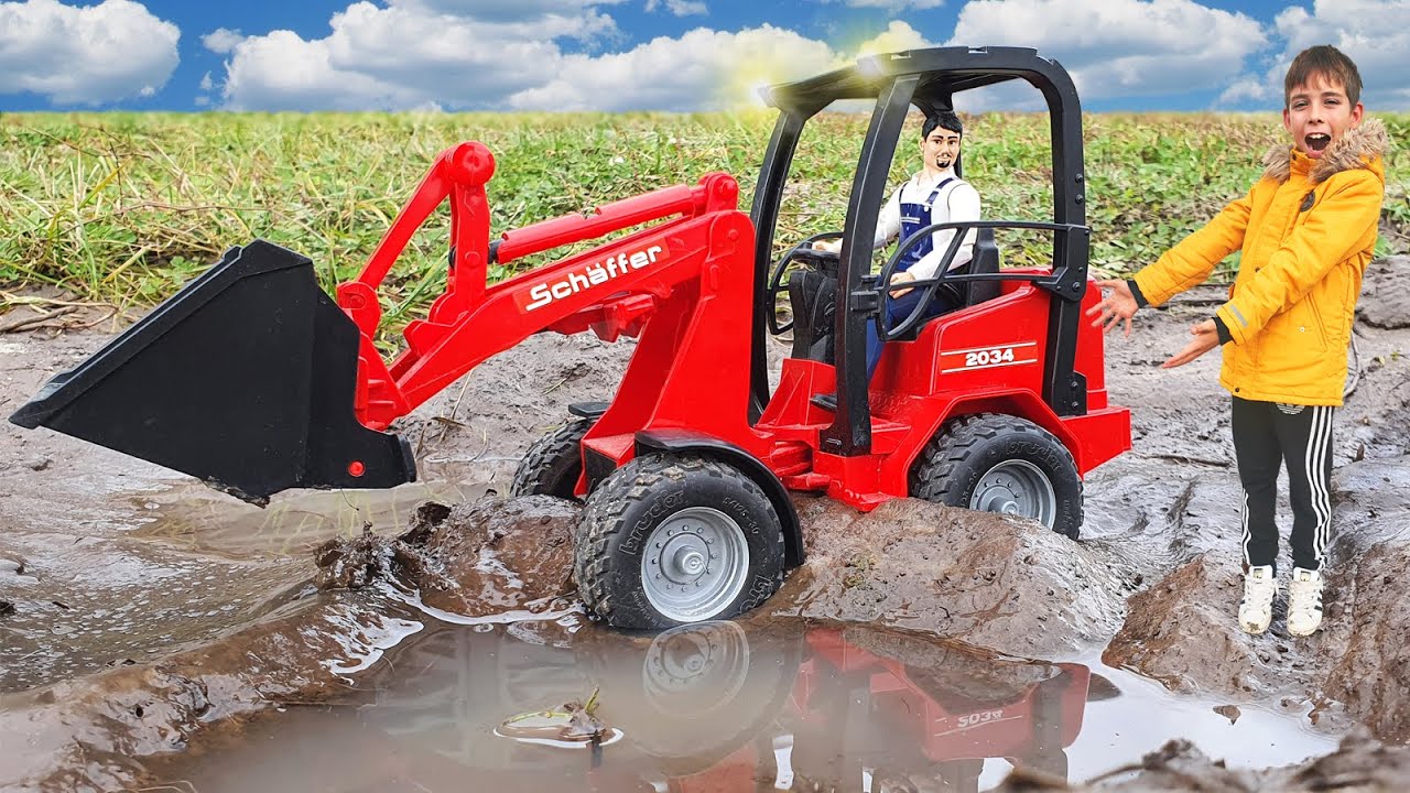 Story about Bruder Schaffer Excavator Loader, Tractor Claas and Truck ...