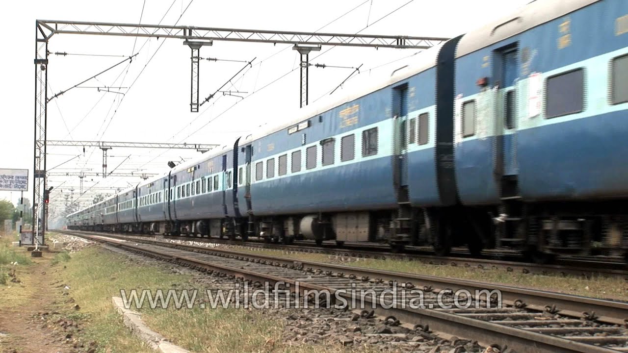 Indian train: Paschim Express hauled by GZB Navgati WAP-7 - YouTube