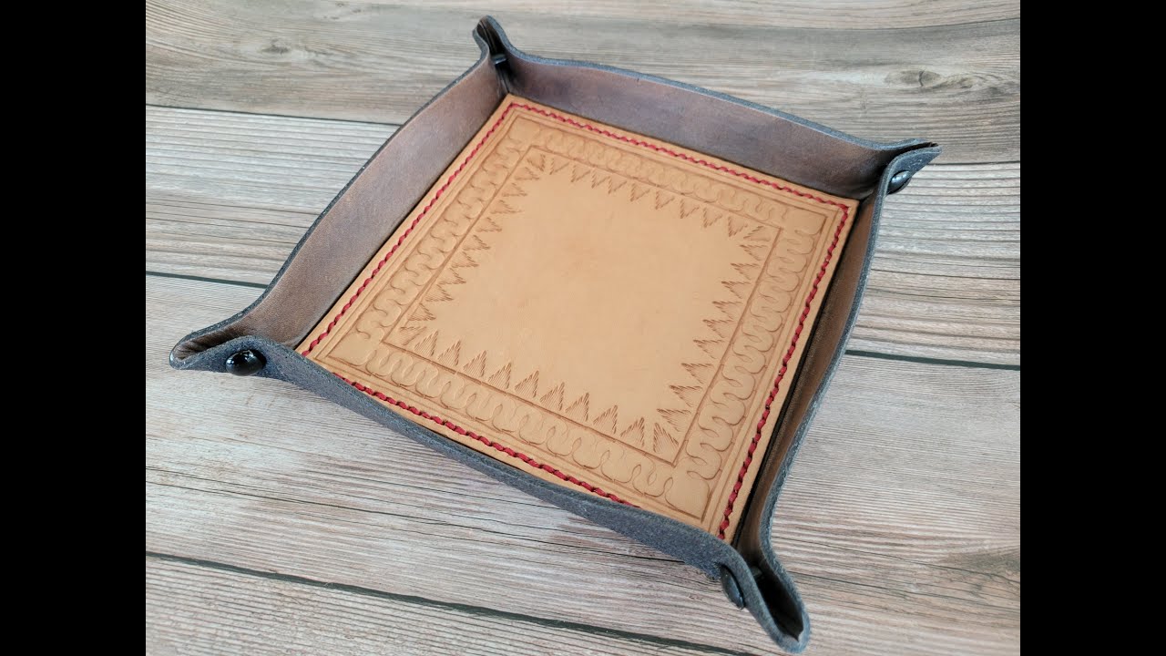 Leather catch all tray with serpentine stamped design. Sped up process ...