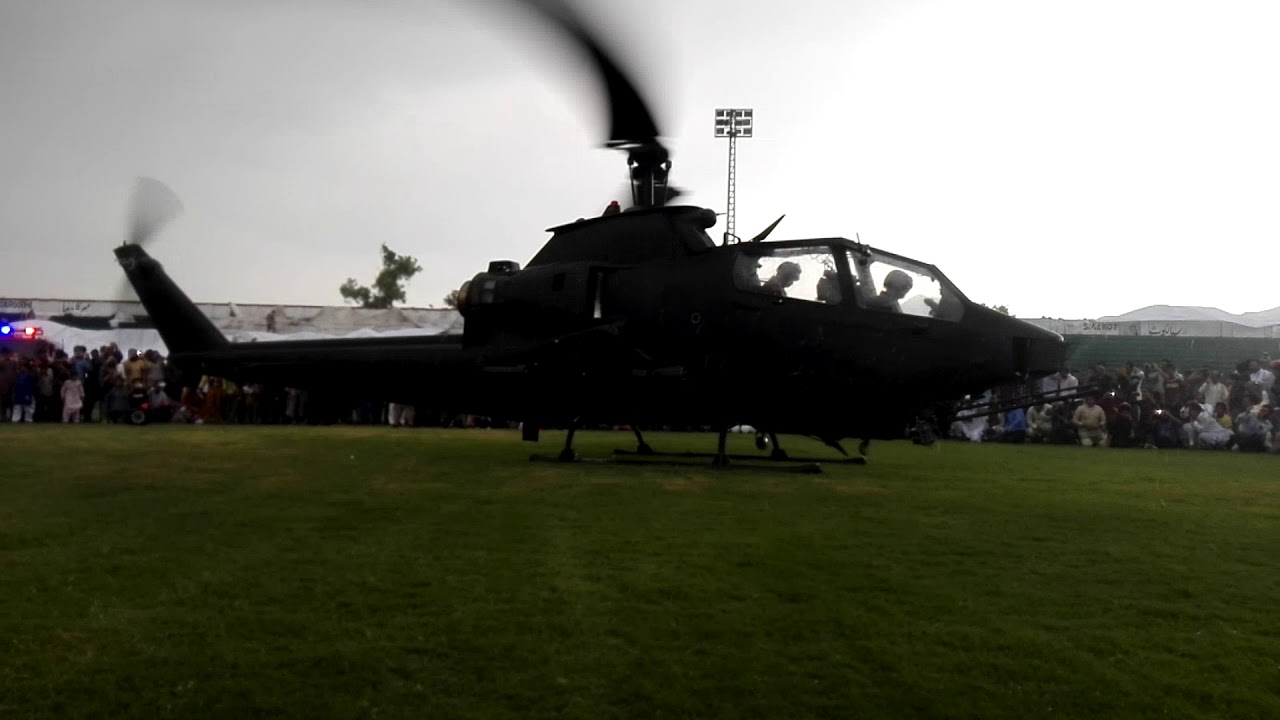 Pakistan army Cobra helicopter take off from Fortress stadium in rain ...
