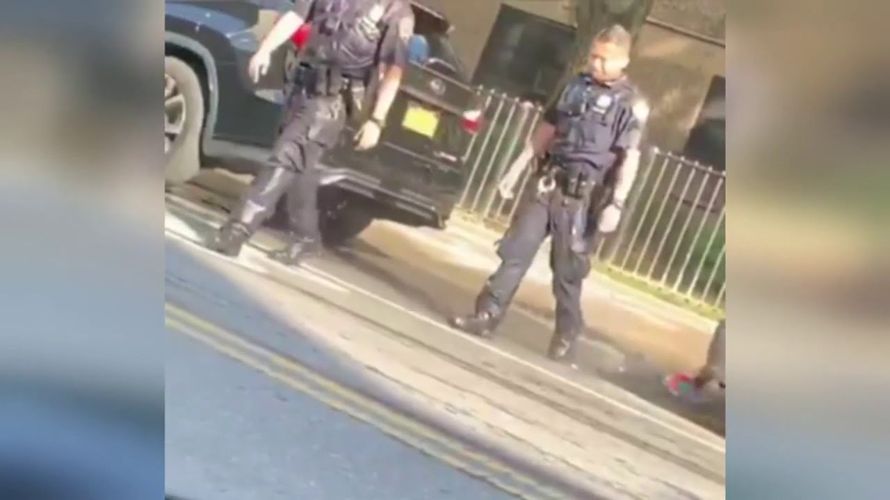 Videos of water being dumped on officers create stir - YouTube