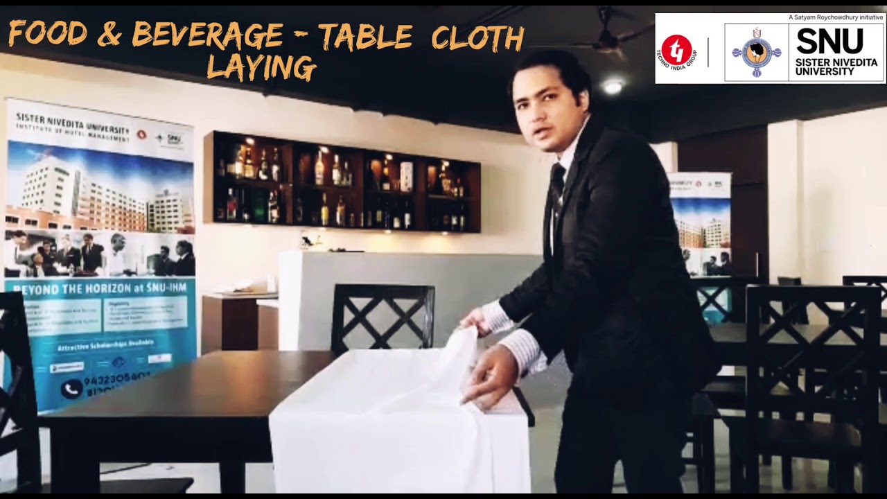 How to lay a table cloth in a restaurant - YouTube