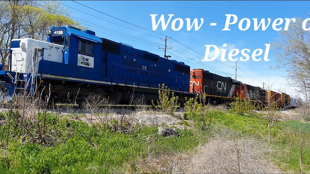 CN long local freight train. Watch until the end to hear the powerful ...