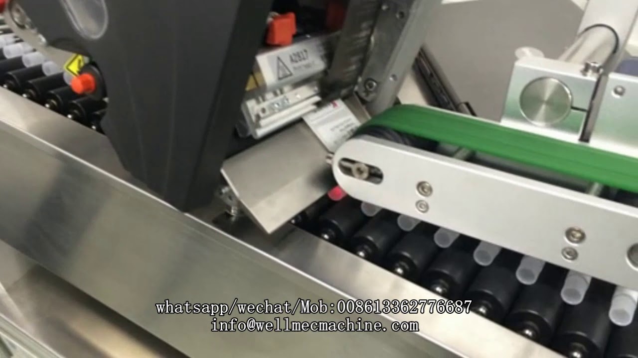 small tube horizontal labeler printing labeling machine - YouTube