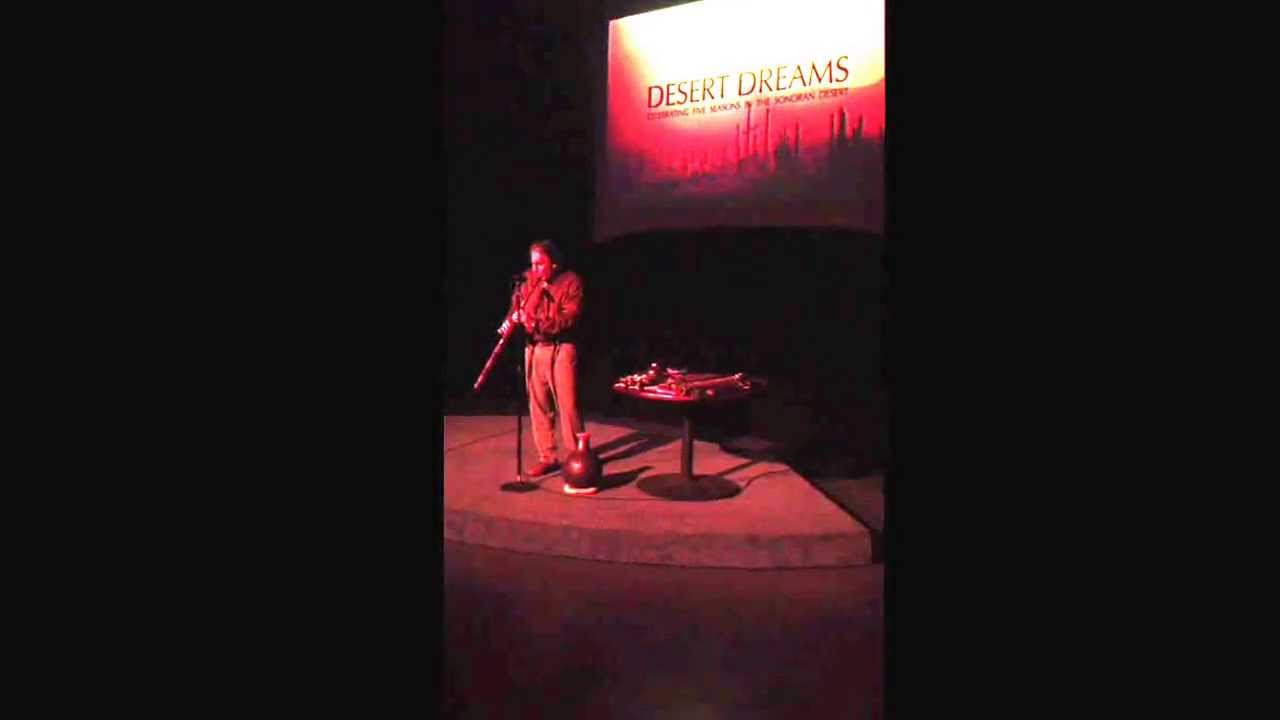 Composer Gary Stroutsos demonstrates one of dozens of indigenous ...