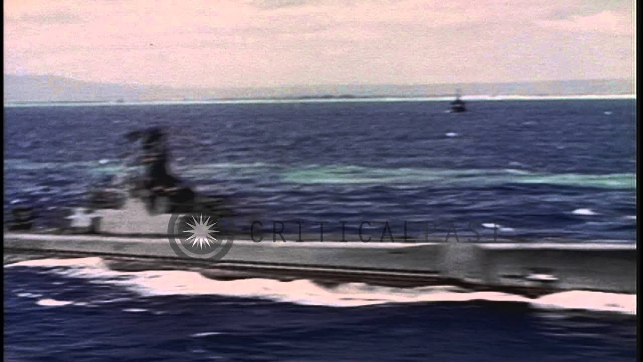 Several ships and submarines underway at the Pearl Harbor Naval Base in ...