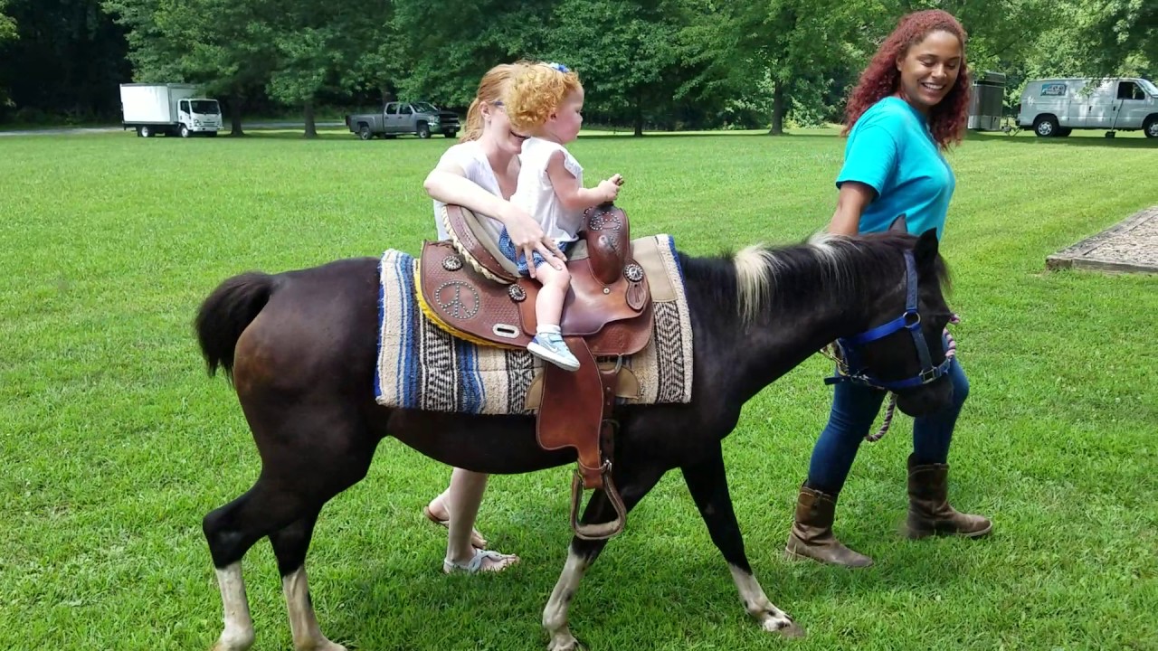 Coral's first pony ride - YouTube