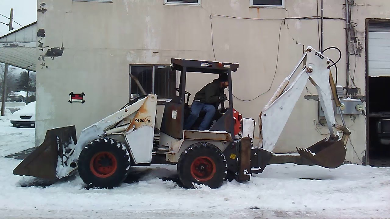 Bobcat 2400 with Backhoe attachment - YouTube