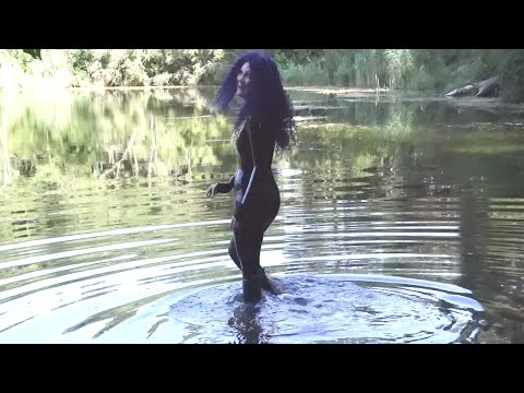 wet latex or latex girl in the lake