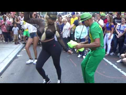 BRAZILIAN GIRLS DANCES STREET SAMBA AT BRAZILIAN CARNIVAL CULTURE CELEBRATION PARADE NEW YORK