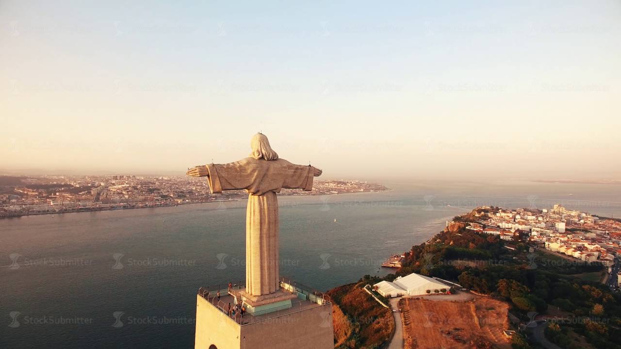 Statue Christ the King Cristo Rei Lisbon Almada at sunset aerial view ...