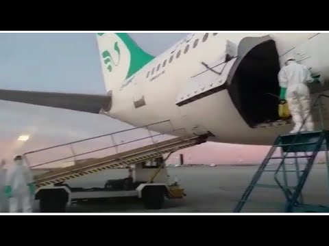 specialists disinfect an airplane infected with corona virus in Tehran ...