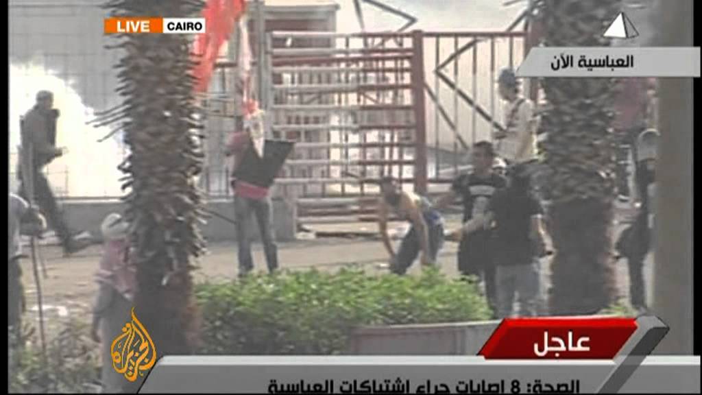 Al Jazeera's Rawya Rageh reports on Cairo clashes - YouTube