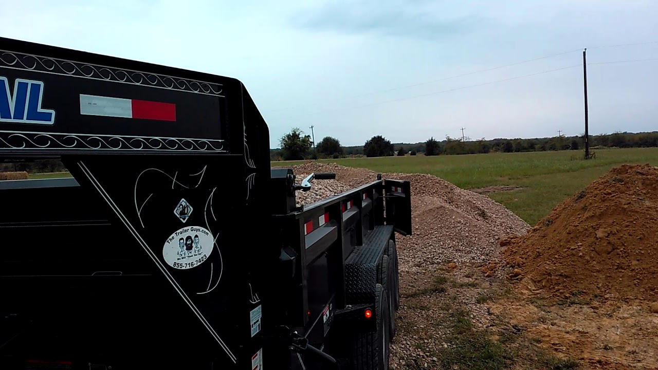 Load Trail triple axle dump trailer.... Overloaded - YouTube