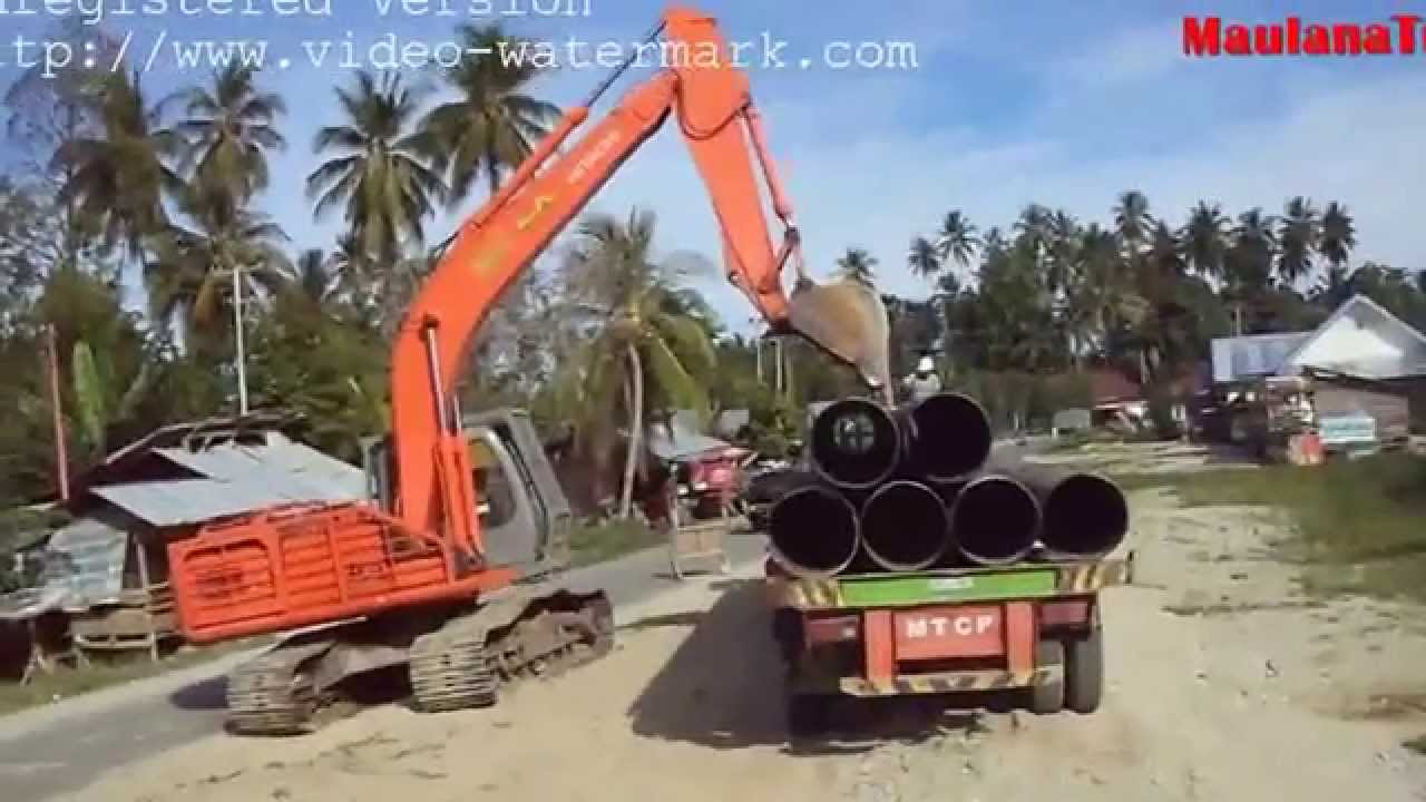 Unloading Steel Pipe with Excavator for Bridge Construction # ...