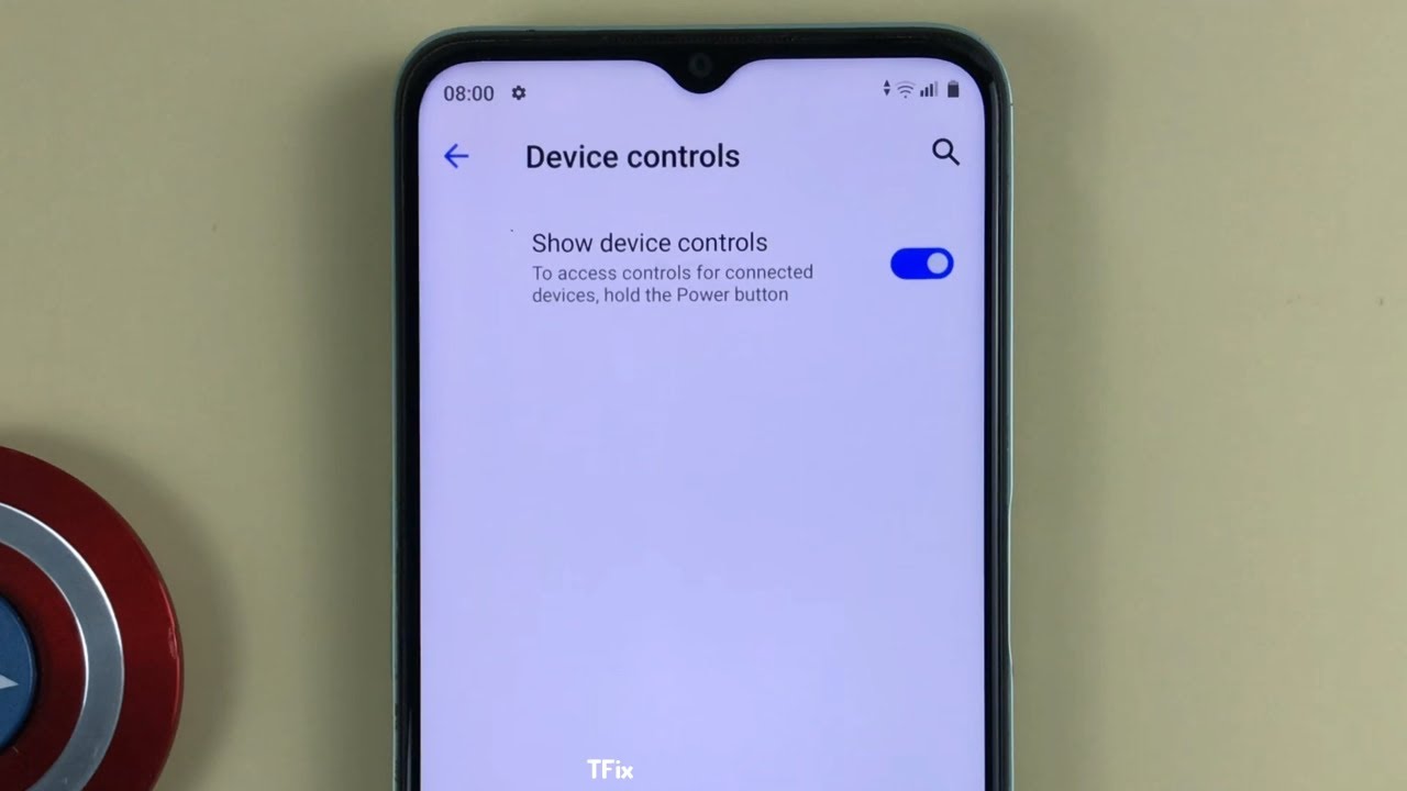 How to hold down the power button to display device control options on ...