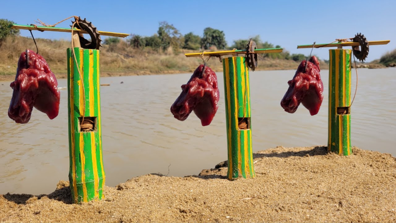 Wow Bamboo wheel hook fishing trap Boy catching fish in river with ...