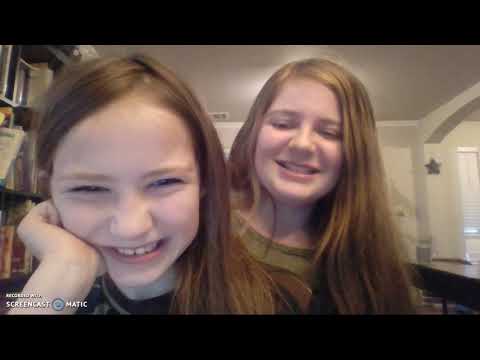 Two girls fight over sitting on a chair at the family dinner table