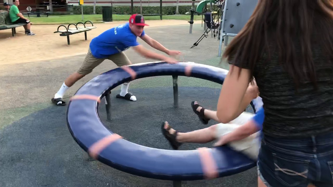 Boy flies off merry-go-round - YouTube