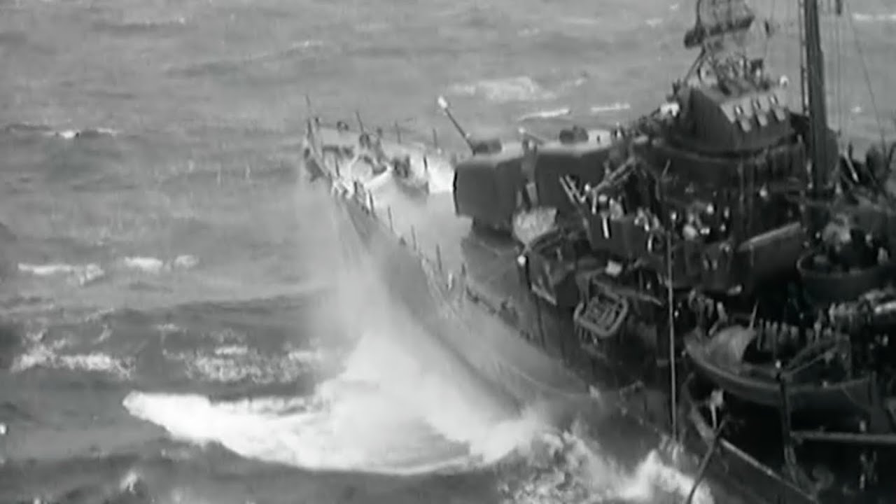 USS Healy (DD-672) refueling from USS Essex (CV-9) in rough seas ...