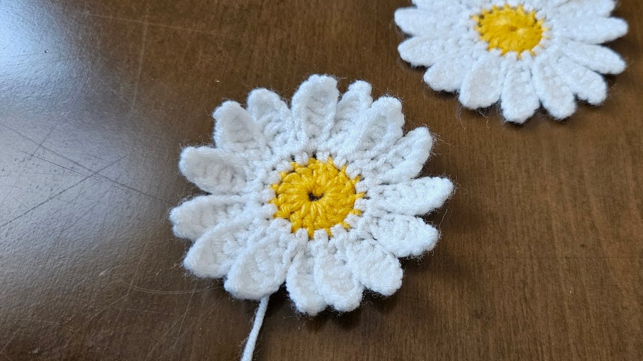Easy knitted daisy flower making with crochet is used in decorations ...