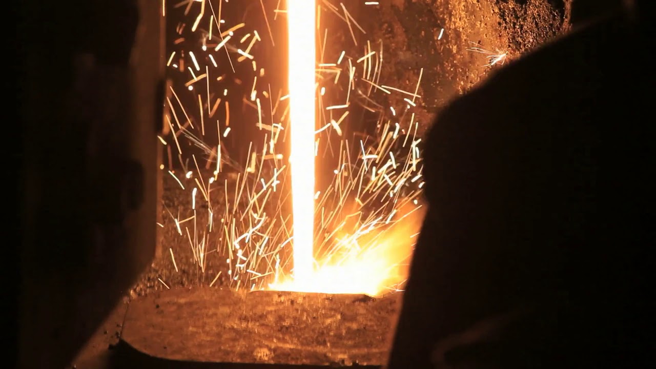 s stream of liquid metal with sparks iron and steel production jet of ...