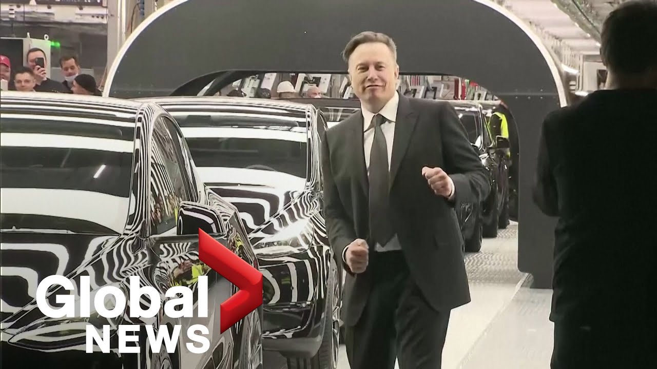 Dancing Elon Musk hands drivers 1st Teslas from new "gigafactory" in ...