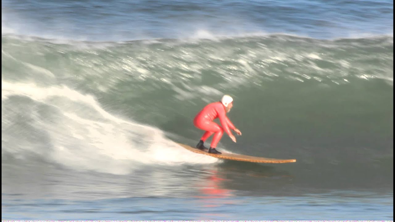 The ledge at Manu Bay Raglan: 12 foot wooden surfboard. - YouTube
