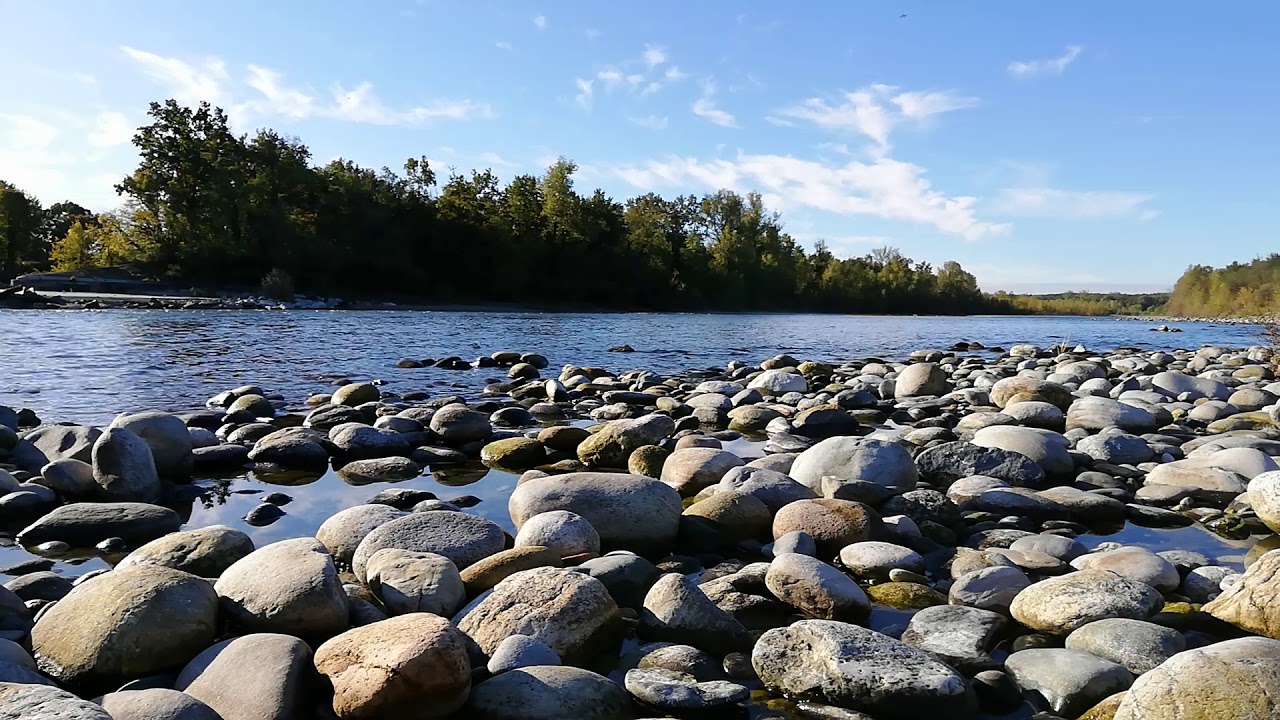 Piles of loose rocks along the riverside - YouTube