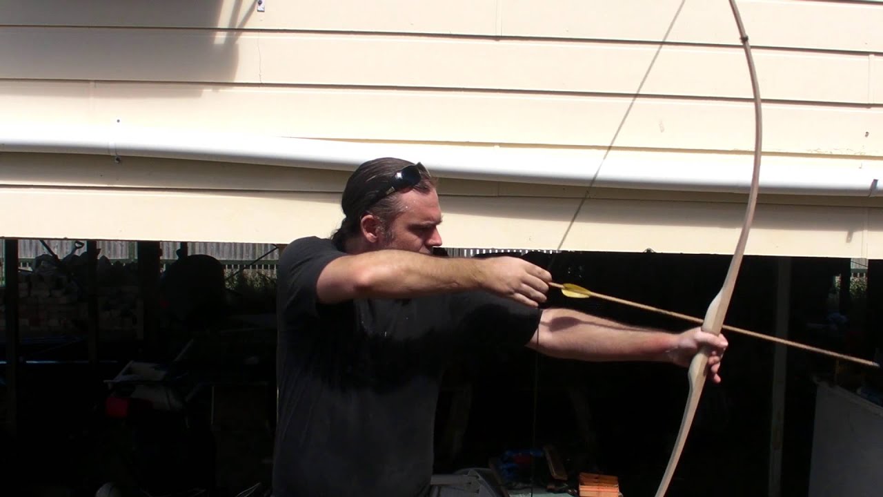 Shooting a home made Red Oak bow. - YouTube