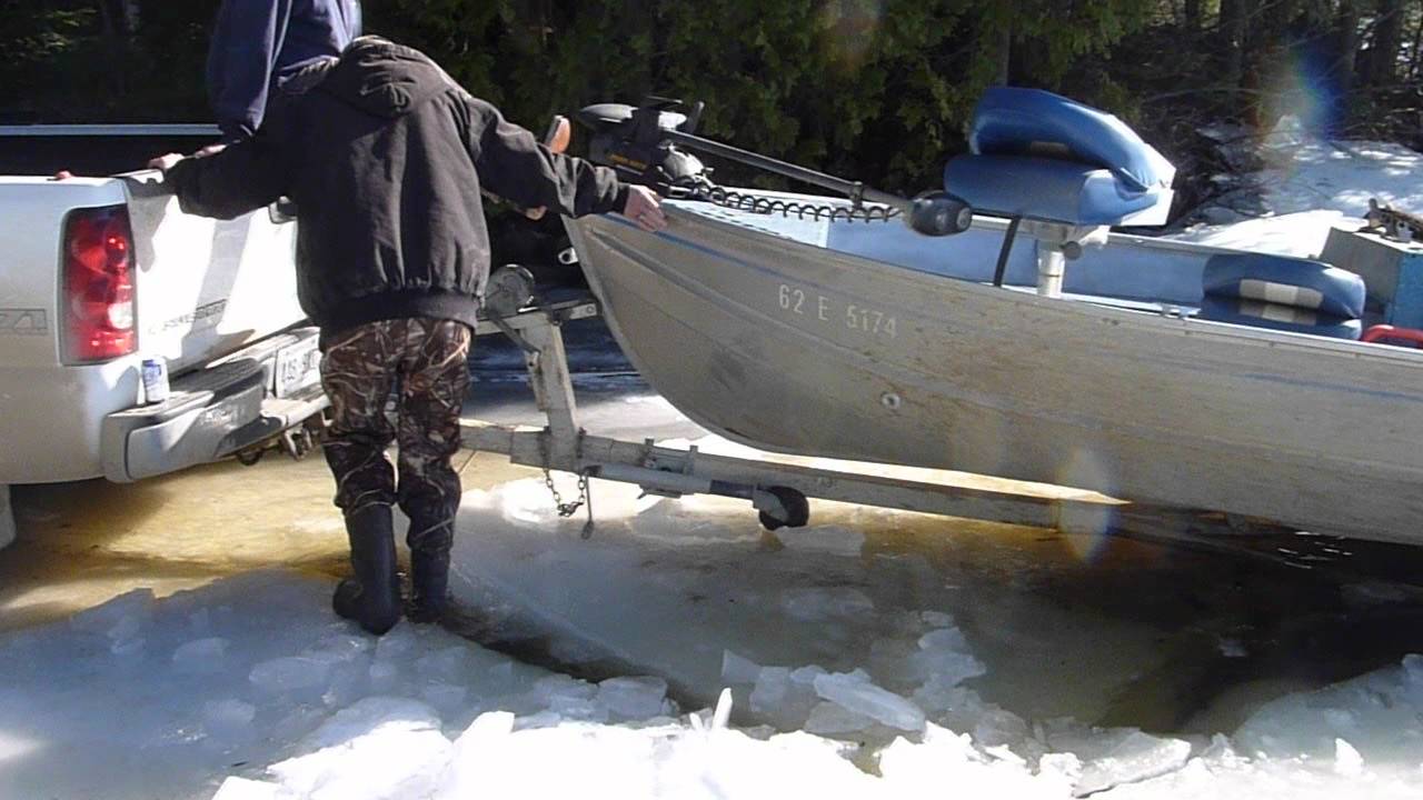 launching boat in water from ice - YouTube