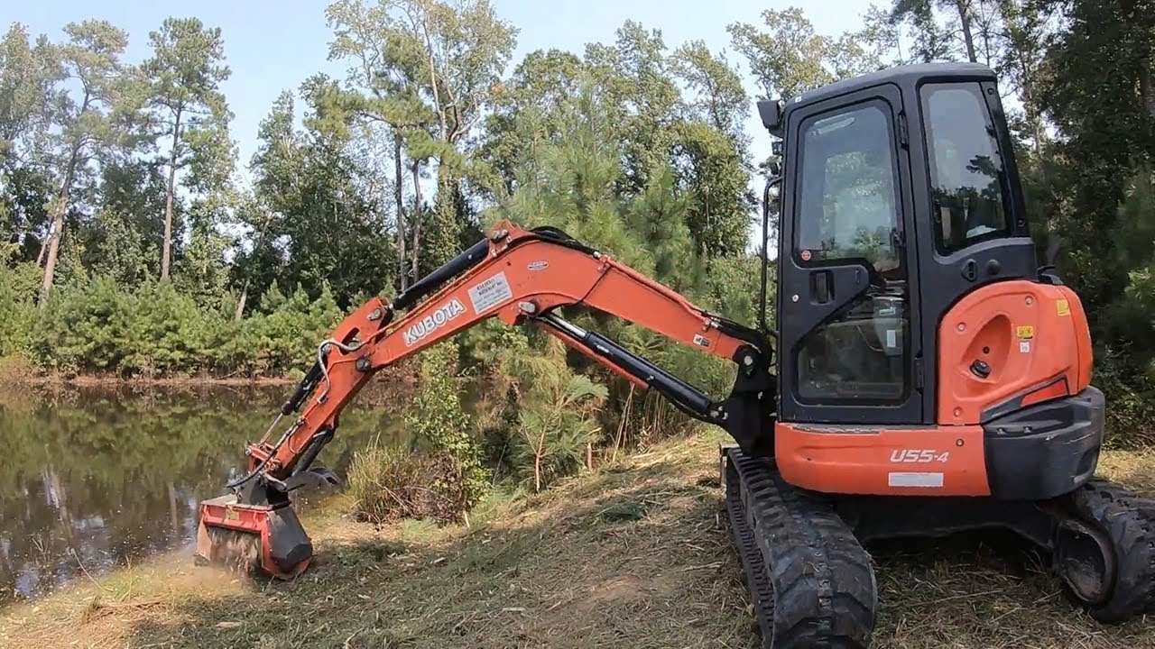 GATOR BAIT!? Mulching A Retention Pond With Prinoth M450e-900! - YouTube