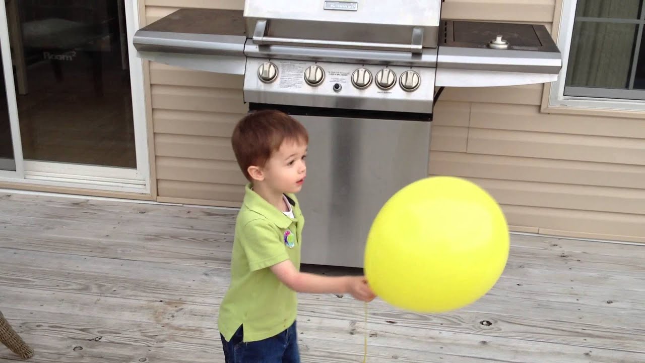 A very young Brennan...letting a balloon go! - YouTube