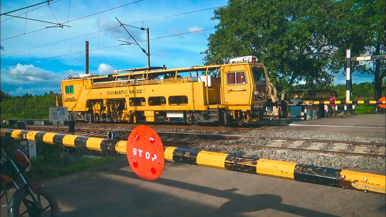 Railgate scenario ! Unique weird looking train crossing rail gate ...