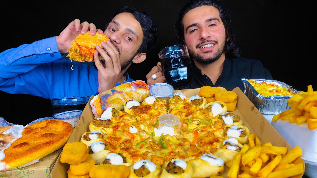 Eating Crown Crust Pizza, Cheese Kabab Roll, Tower Burger, Crunchy ...