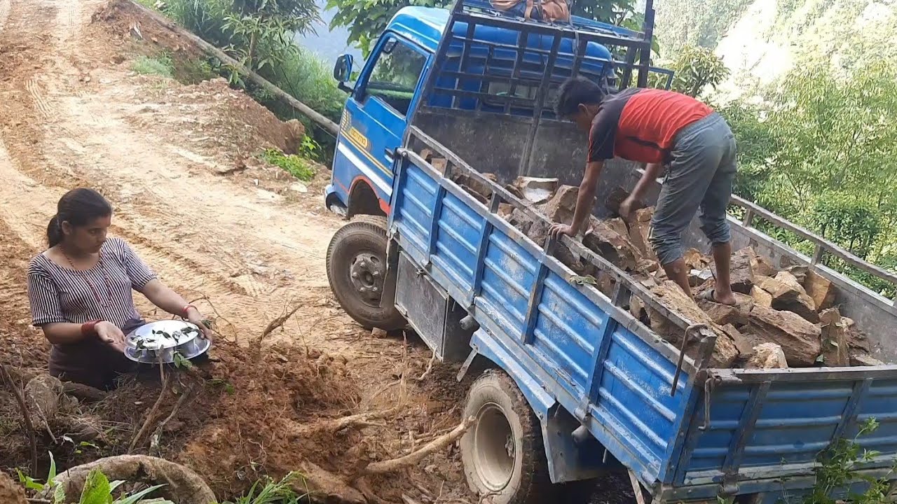 Hard working mountain village men loading stone for construction ...